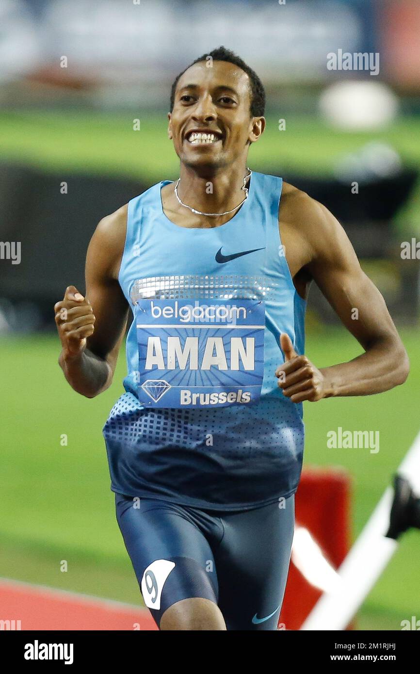 Ethiopia's Mohammed Aman celebrates as he crosses the finish line to ...