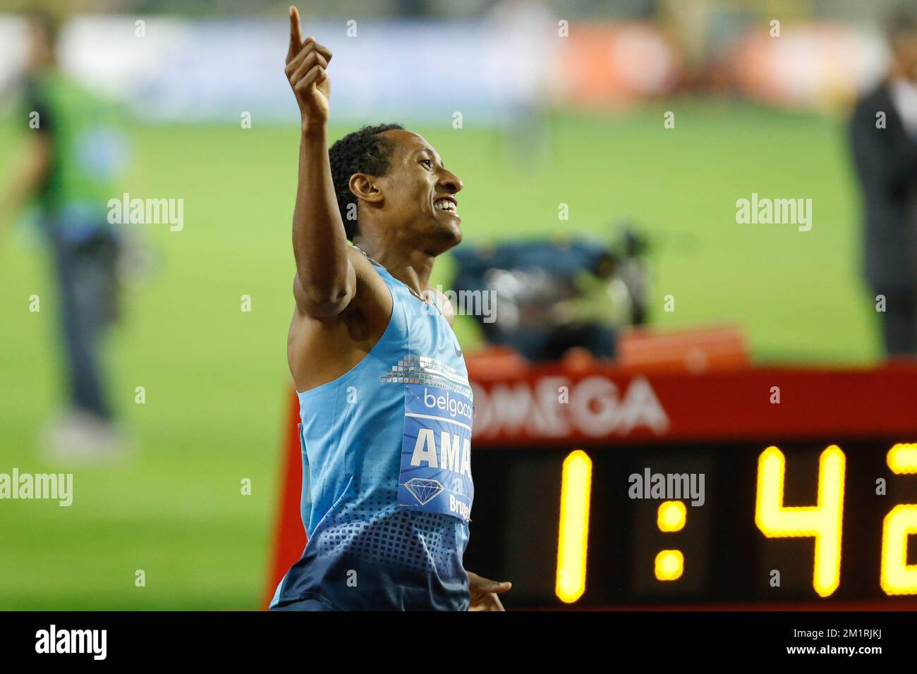Ethiopia's Mohammed Aman celebrates as he crosses the finish line to ...