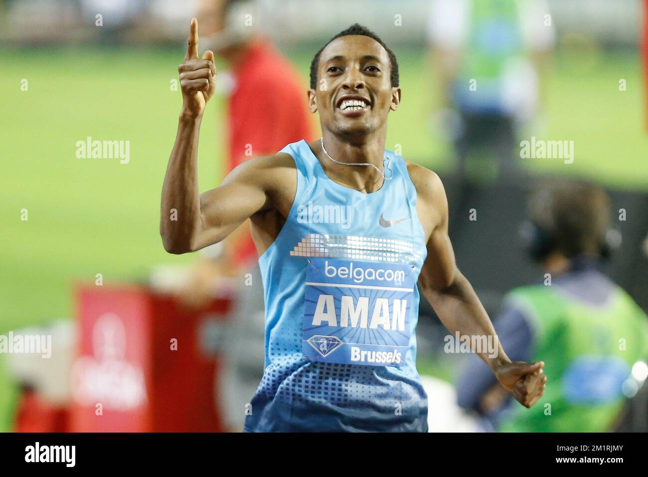 Ethiopia's Mohammed Aman celebrates as he crosses the finish line to ...
