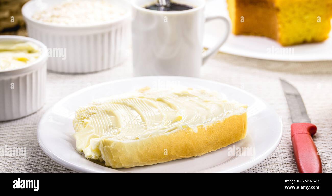 slice of salt bread cut with butter, called French bread in Brazil ...