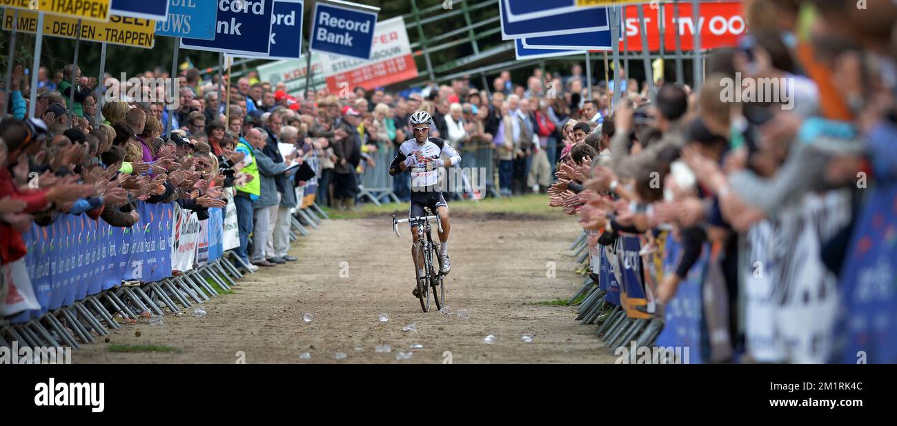 Belgian Niels Albert celebrates as he crosses the finish line to win ...