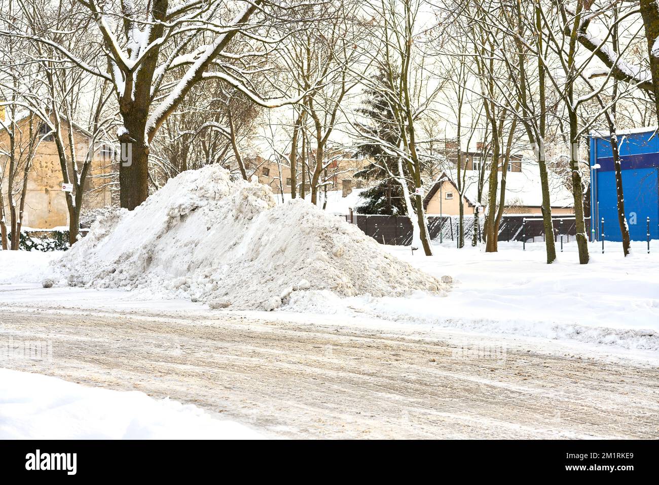 A big snowdrift near the road with dirty snow in winter Stock Photo - Alamy