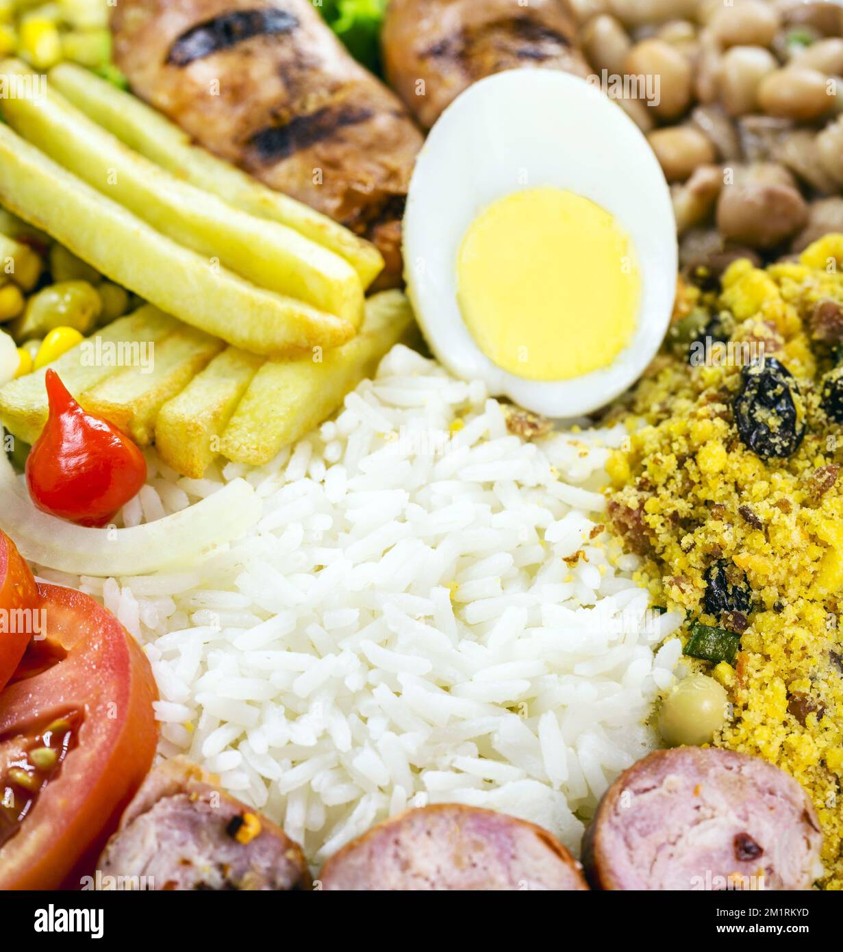 typical brazilian meal, rice and beans, tomato salad, boiled egg and ...