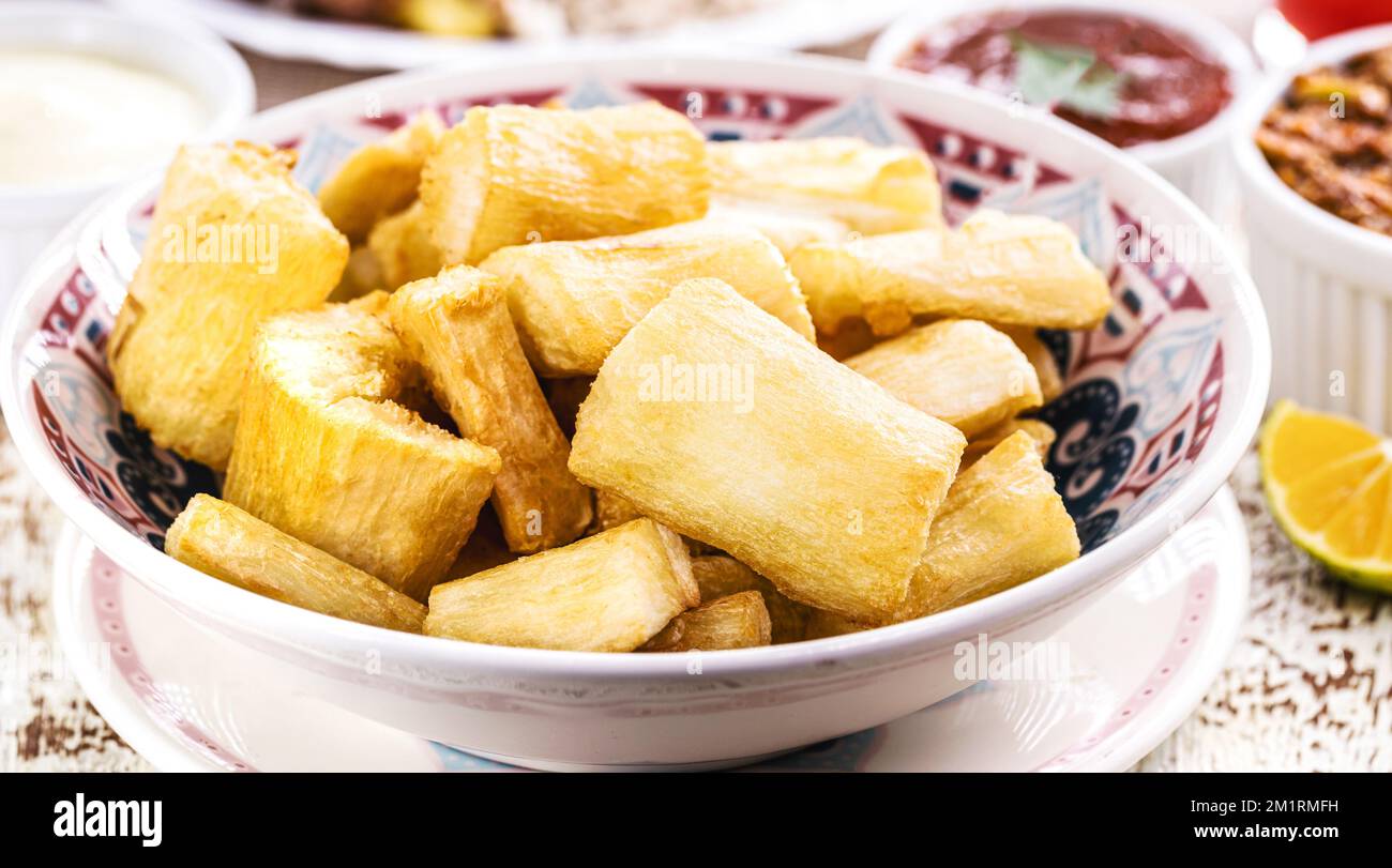 fried sweet cassava, served with vegetables and spices, typical ...