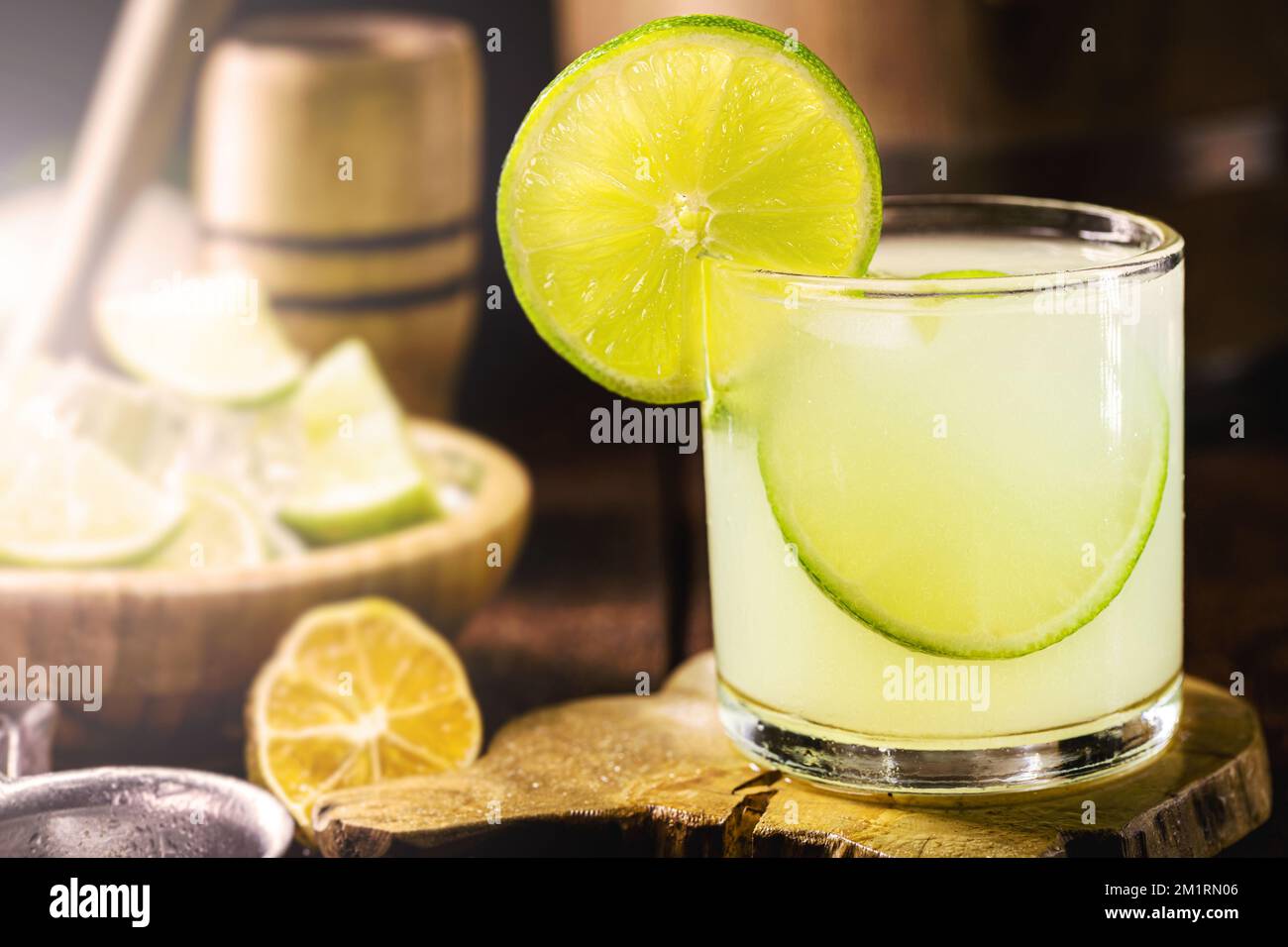 glass with typical Brazilian drink called "caipirinha", made with lemon ...