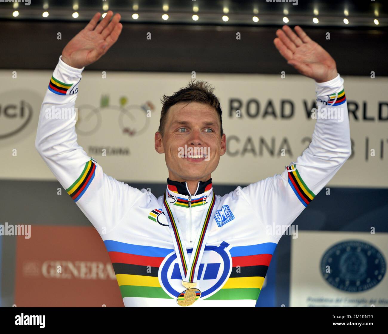 Tony Martin celebrates on the podium with his gold medal after winning ...