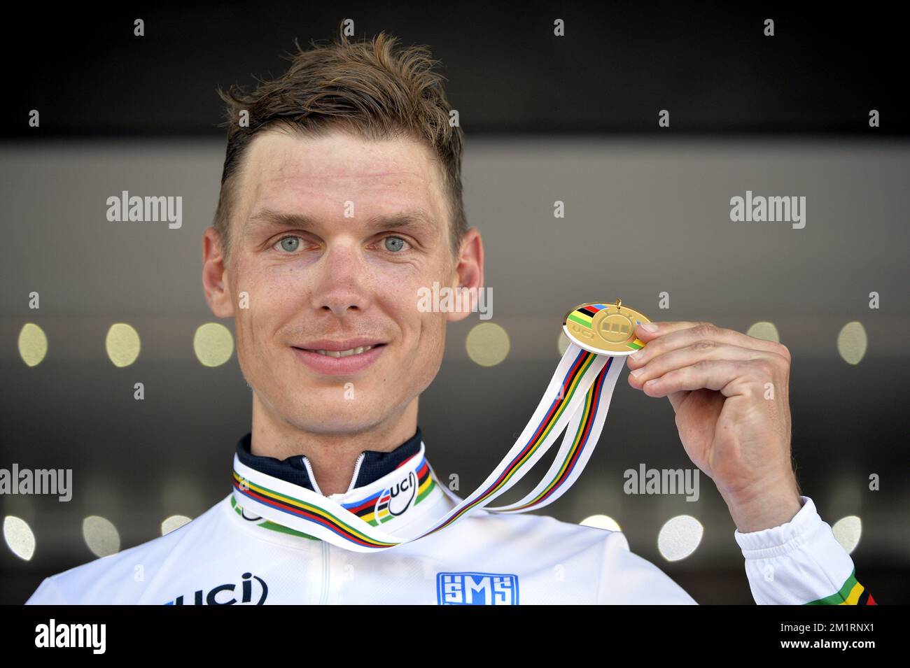 Tony Martin celebrates on the podium with his gold medal after winning ...