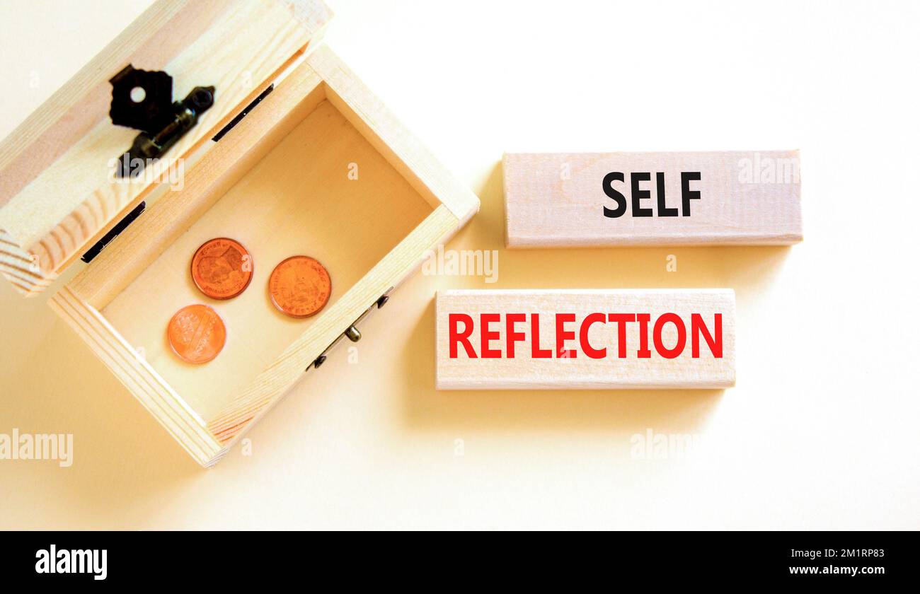Self reflection symbol. Concept word Self reflection on wooden blocks ...