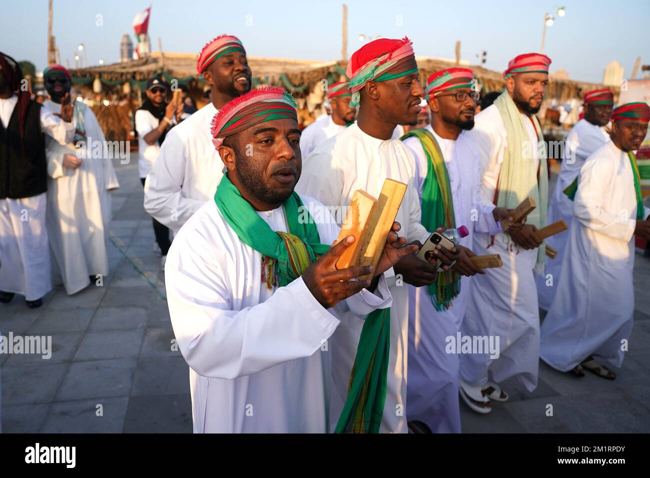 Local people with instruments perform in the Katara Cultural Village in ...