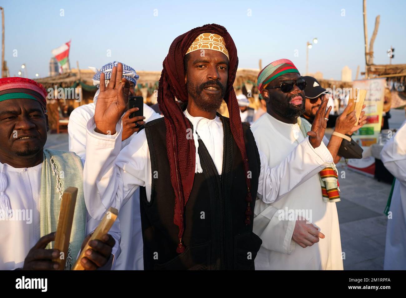 Local people with instruments perform in the Katara Cultural Village in ...