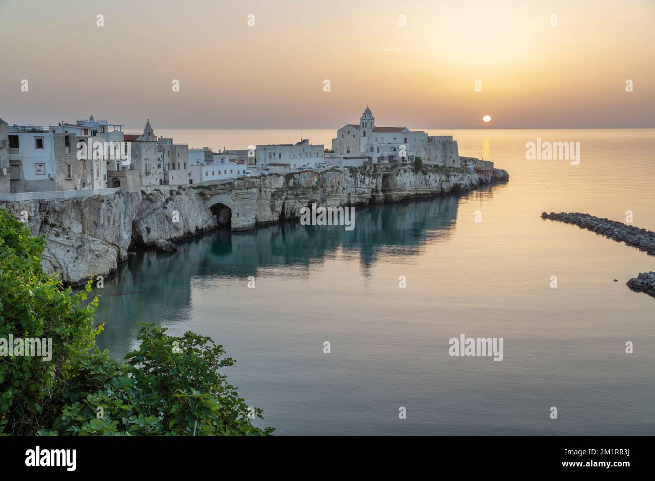 The old town on the promontory at sunrise, Vieste, Gargano peninsula ...