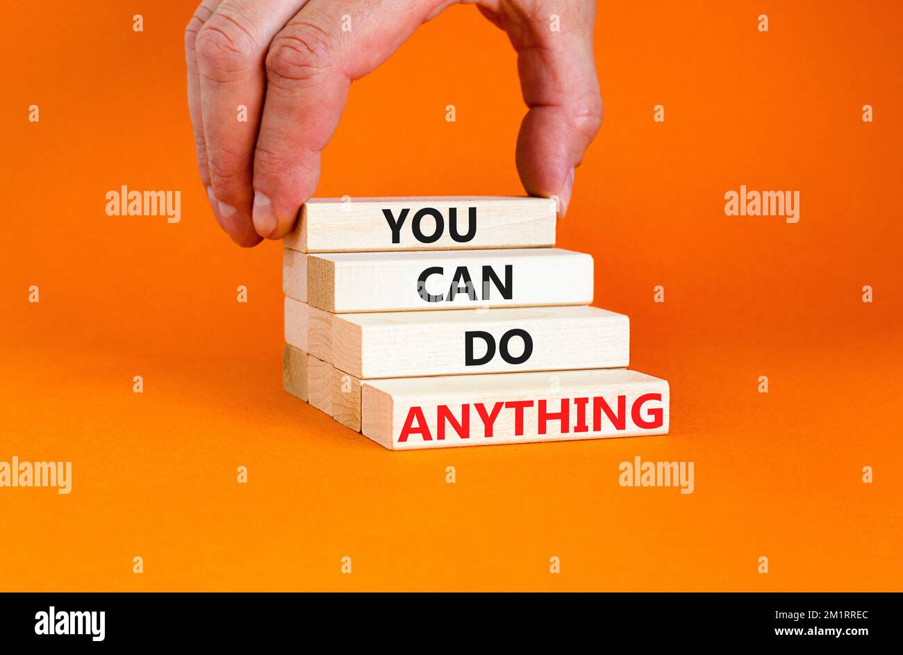 You can do anything symbol. Concept word You can do anything on wooden blocks. Businessman hand ...