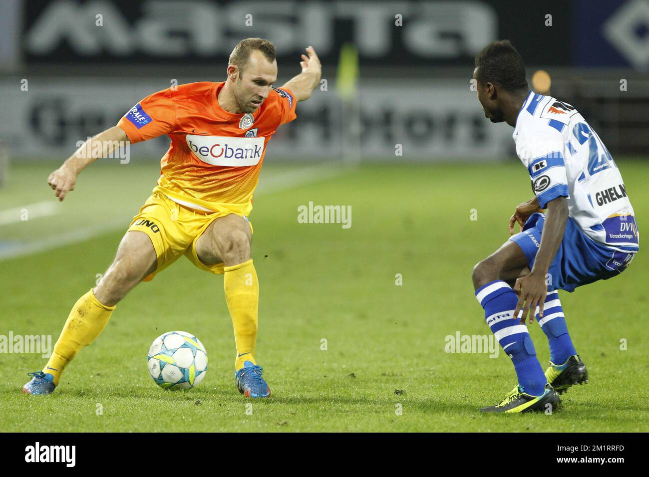 Genk's Thomas Buffel and Gent's Yaya Soumahoro fight for the ball ...