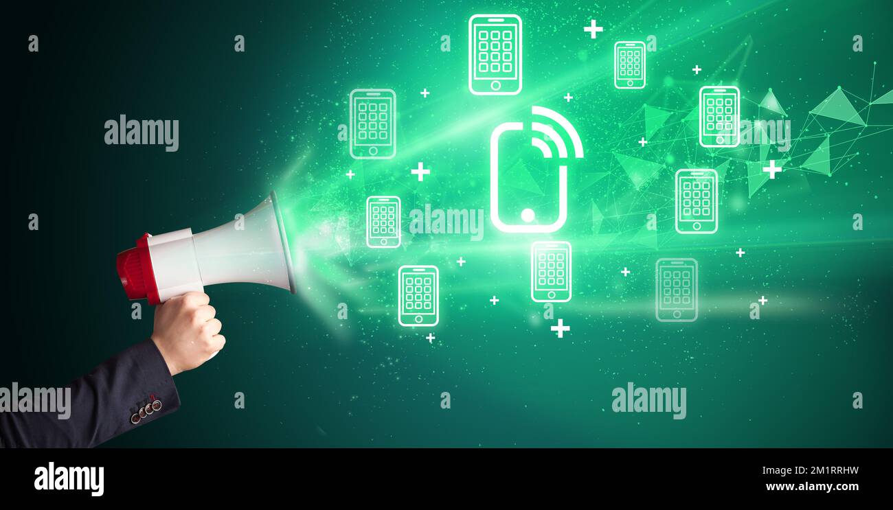 Young person with megaphone and technology related icon Stock Photo - Alamy