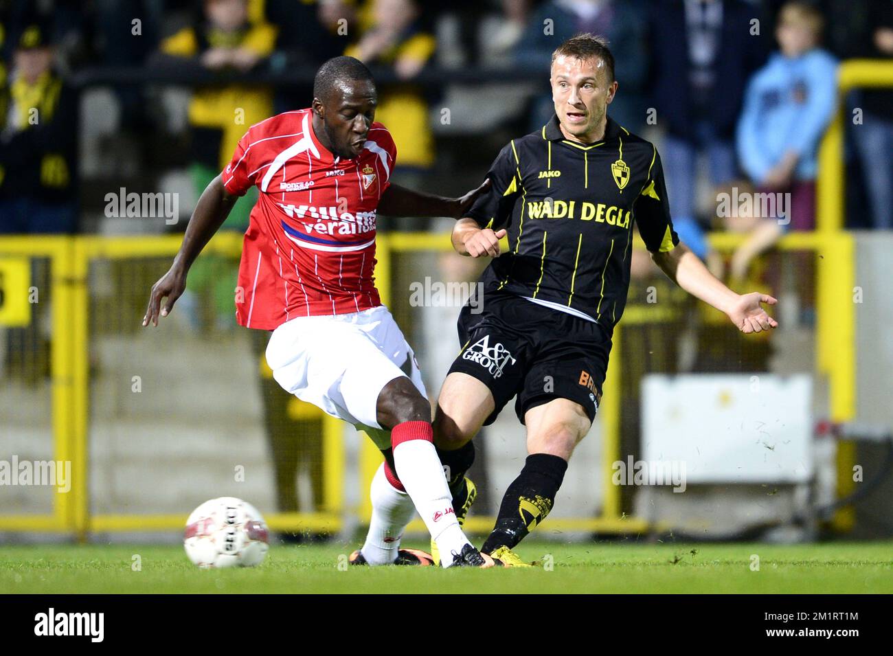 Mons' Richard Soumah and Lierse's Enar Jaager fight for the ball during ...