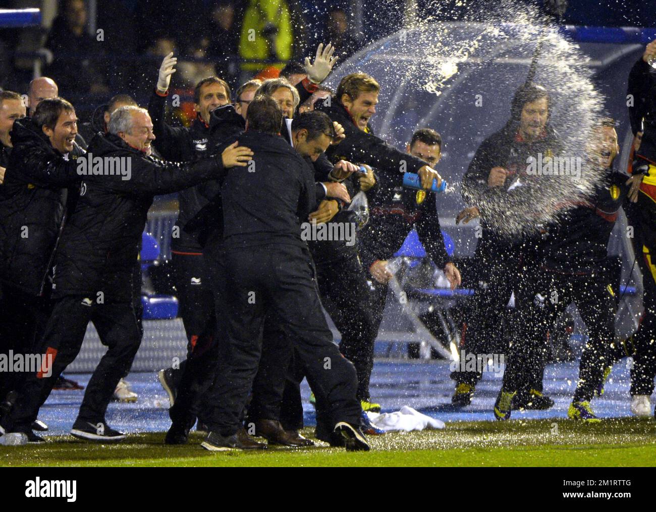 Belgium's head coach Marc Wilmots (C) and Red Devils players and staff ...