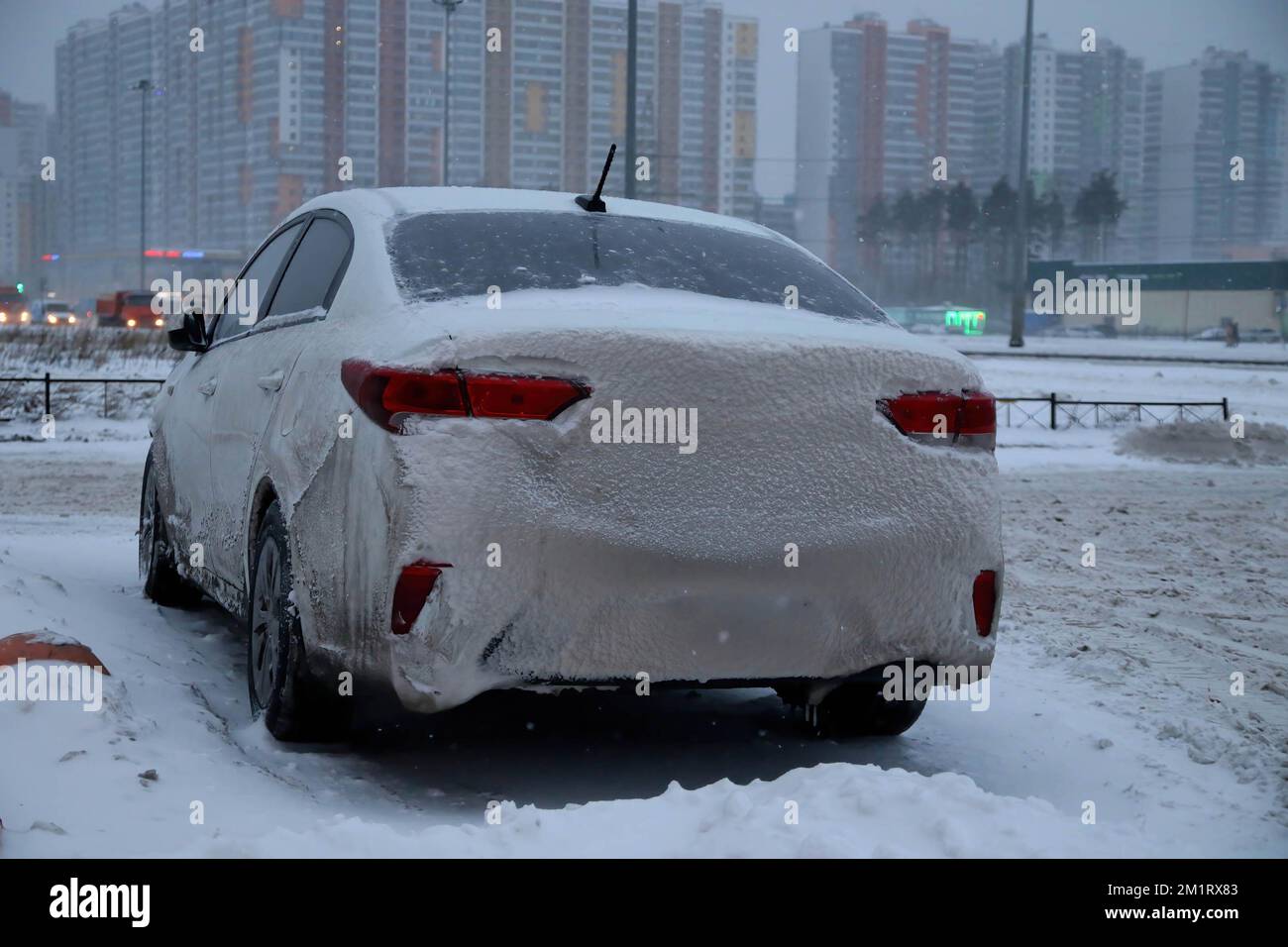 A Hyundai passenger car seen covered with snow during a heavy snowfall ...