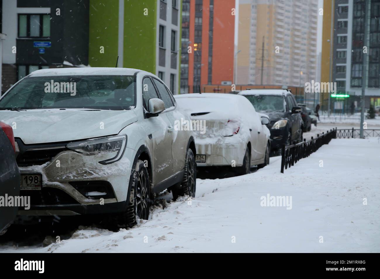 Cars got stuck in the snow in the courtyard of an apartment after a ...