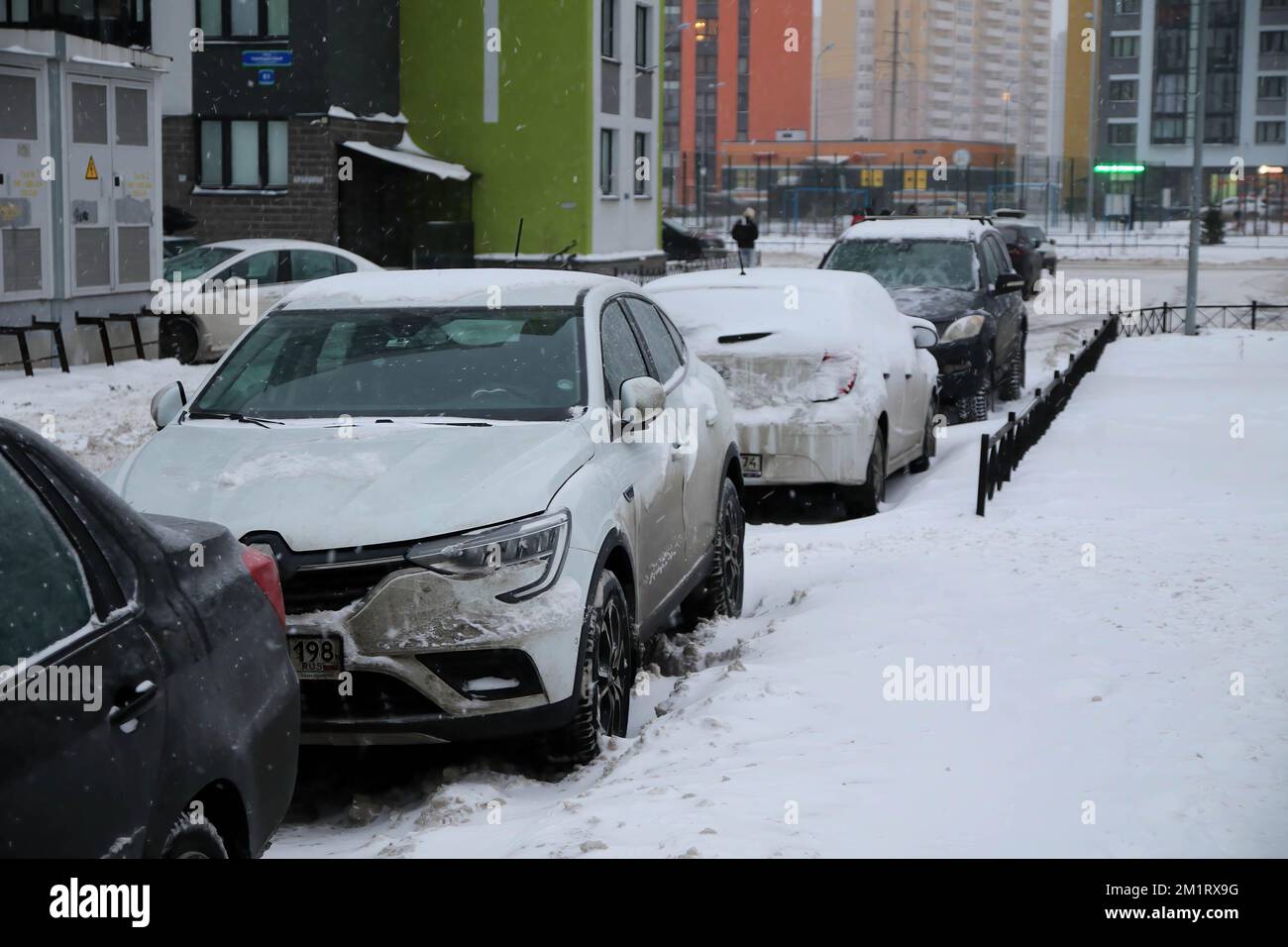 Cars got stuck in the snow in the courtyard of an apartment after a ...