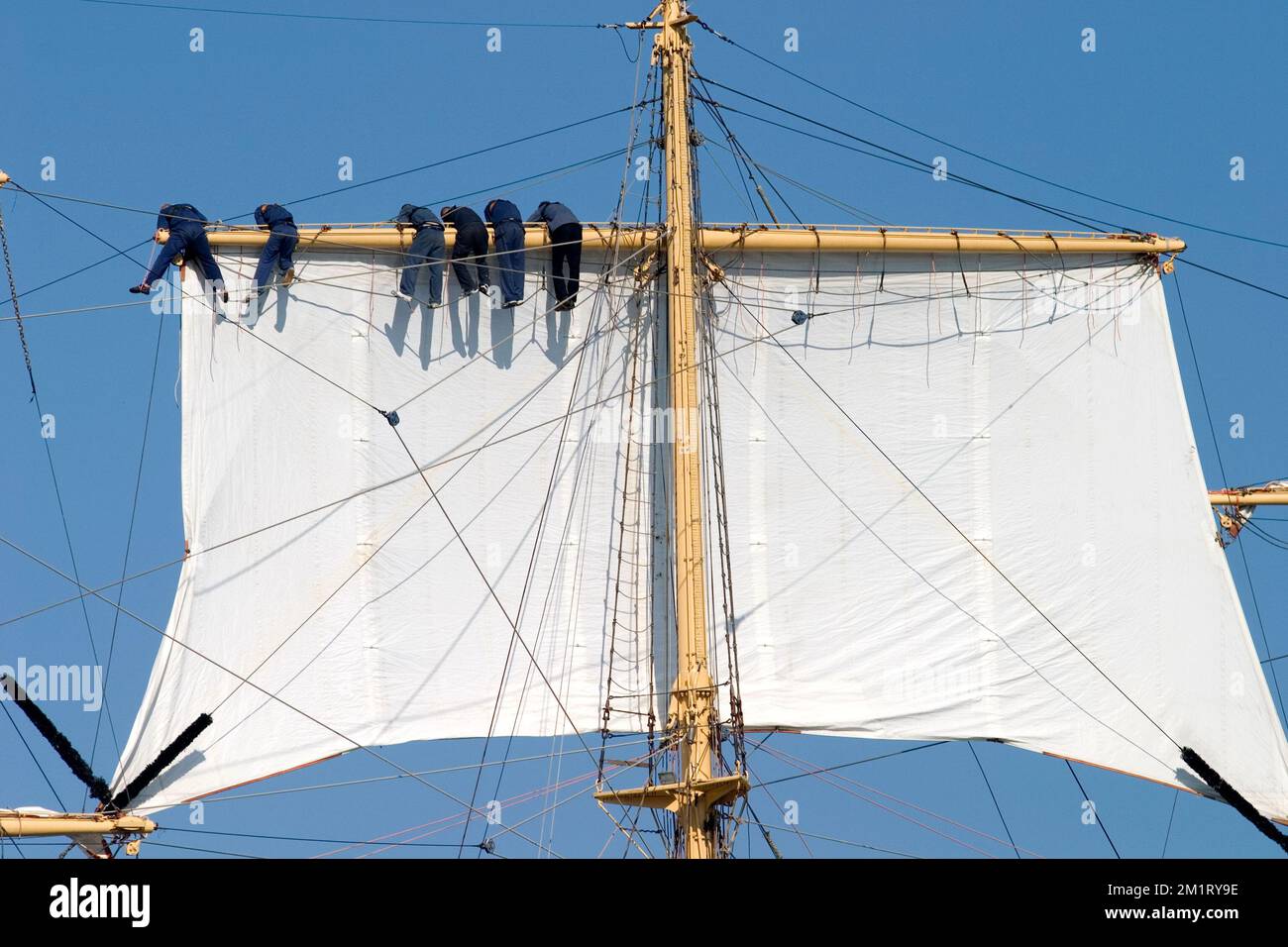 Sailors aloft on Norwegian tall ship Christian Radich Stock Photo - Alamy