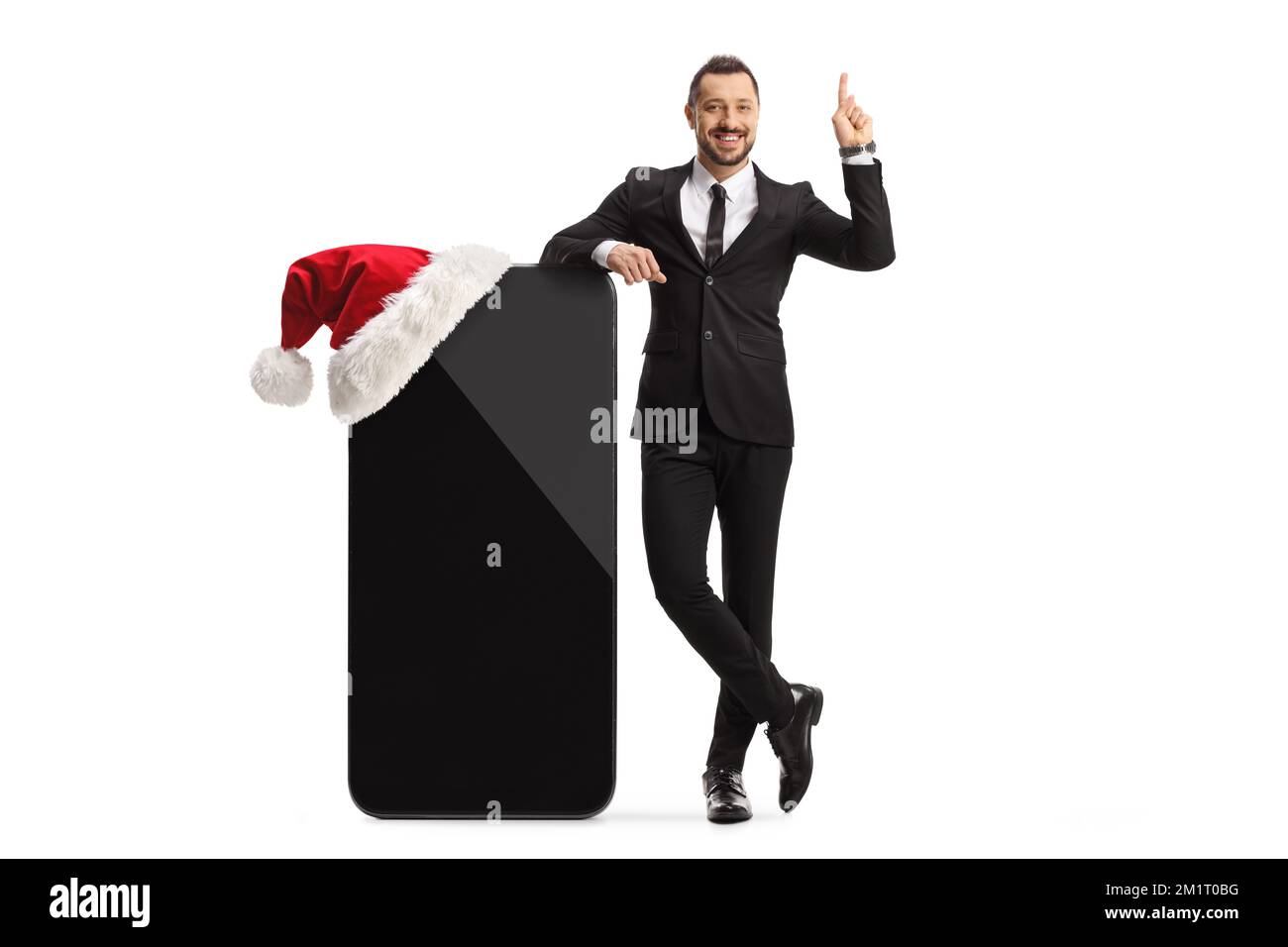 Full length portrait of a businessman leaning on a big mobile phone ...