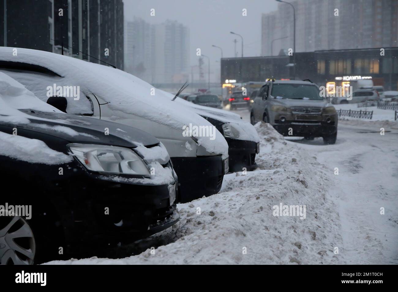 Cars got stuck in the snow in the courtyard of an apartment after a ...
