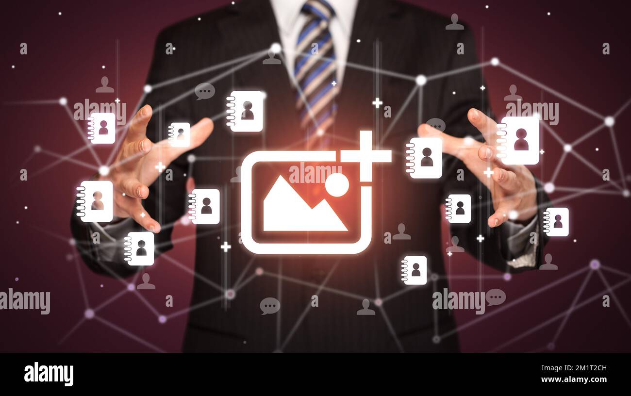 Hand holding social media icons Stock Photo - Alamy