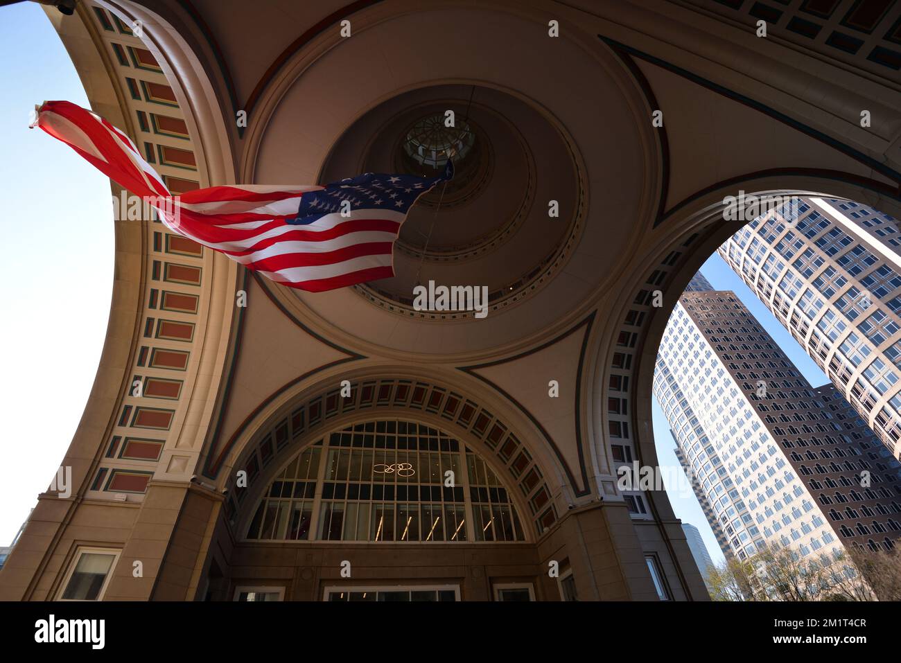 Flag of the United States waving in the Arch at Rowes Wharf, Financial ...