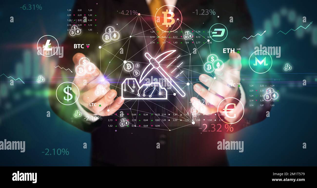 Businessman holding currency symbols concept Stock Photo - Alamy