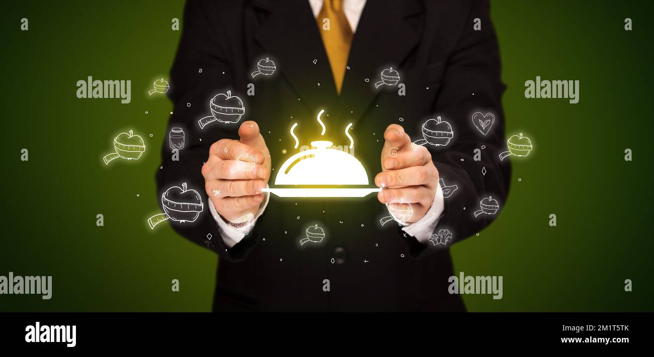 Hand holding food related icons Stock Photo - Alamy