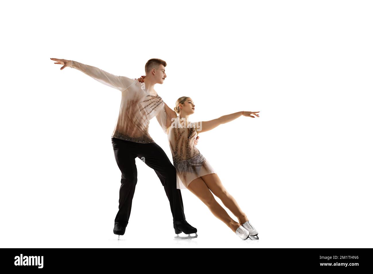 Portrait of young man and woman, figure skating athletes performing ...
