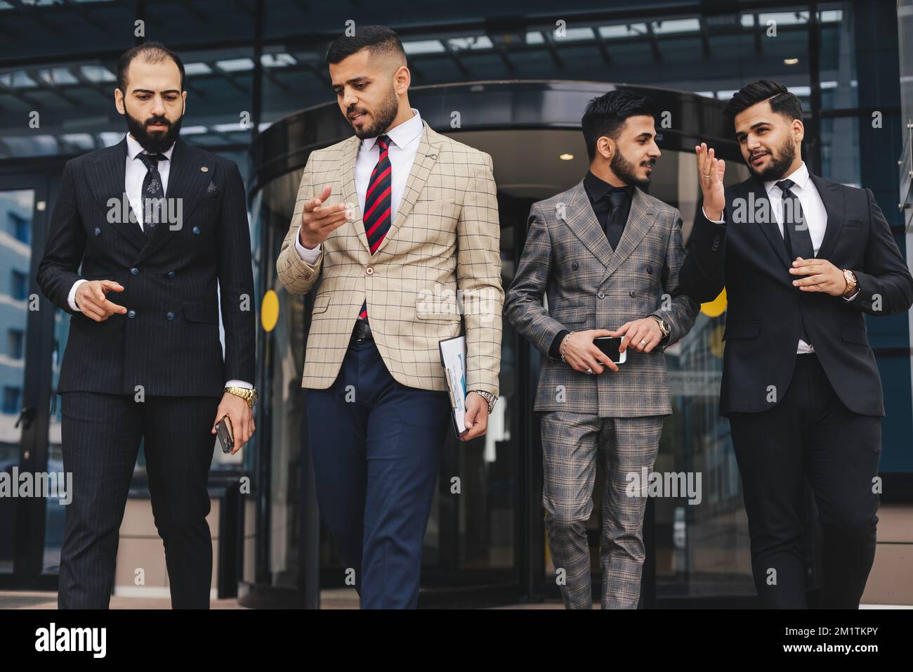 Business people outdoor meeting, A group of male businessmen in suits ...