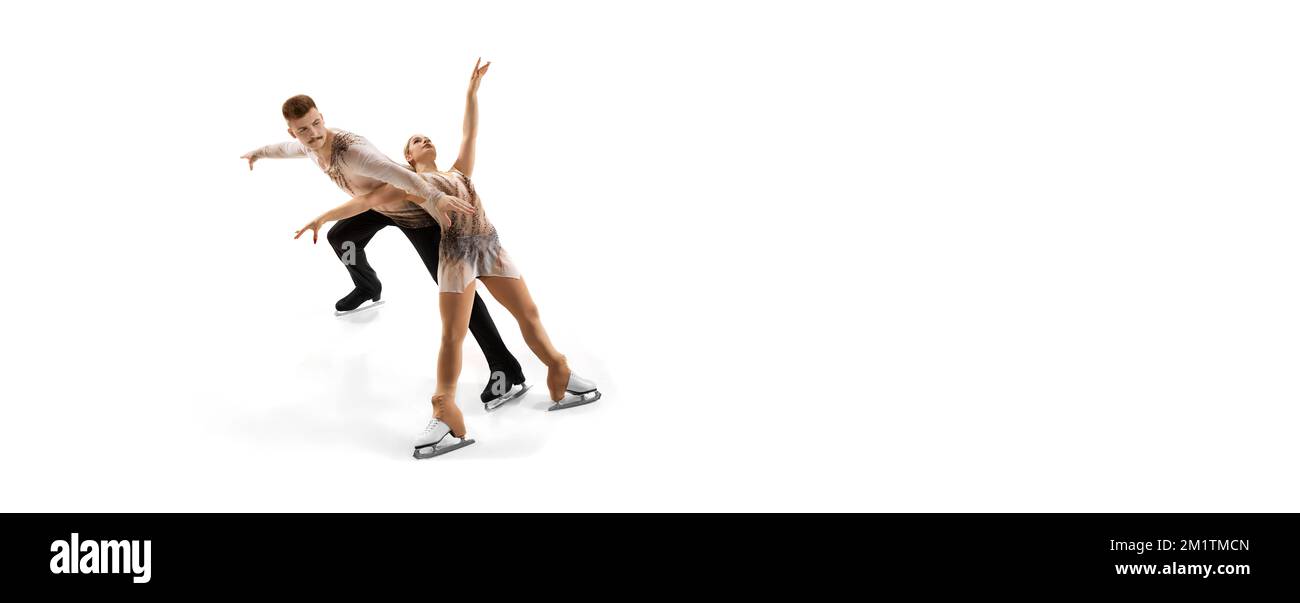 Portrait of young man and woman, figure skating athletes performing ...