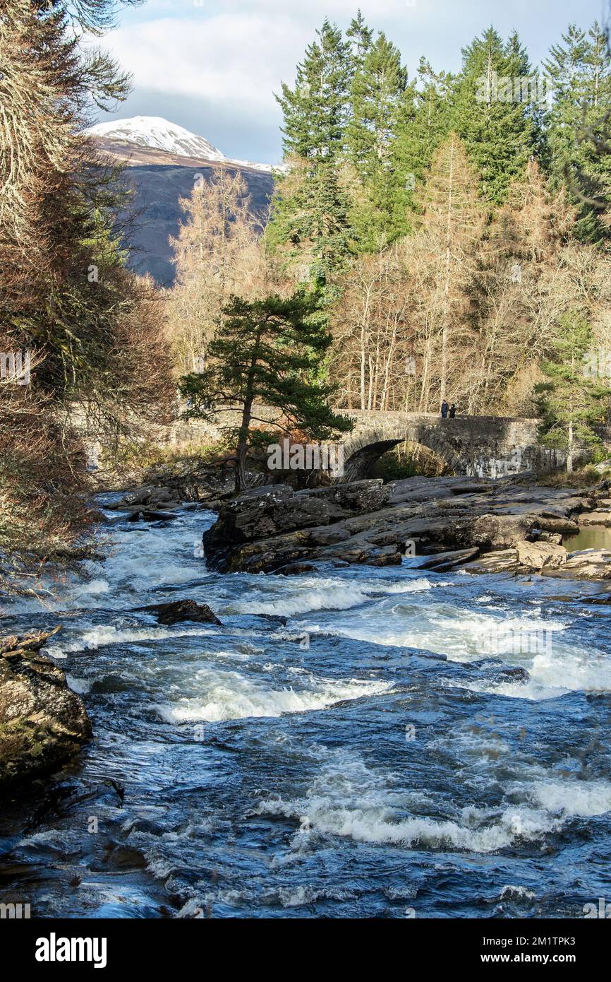 Portrait format: Falls of Dochart looking downstream towards the bridge ...