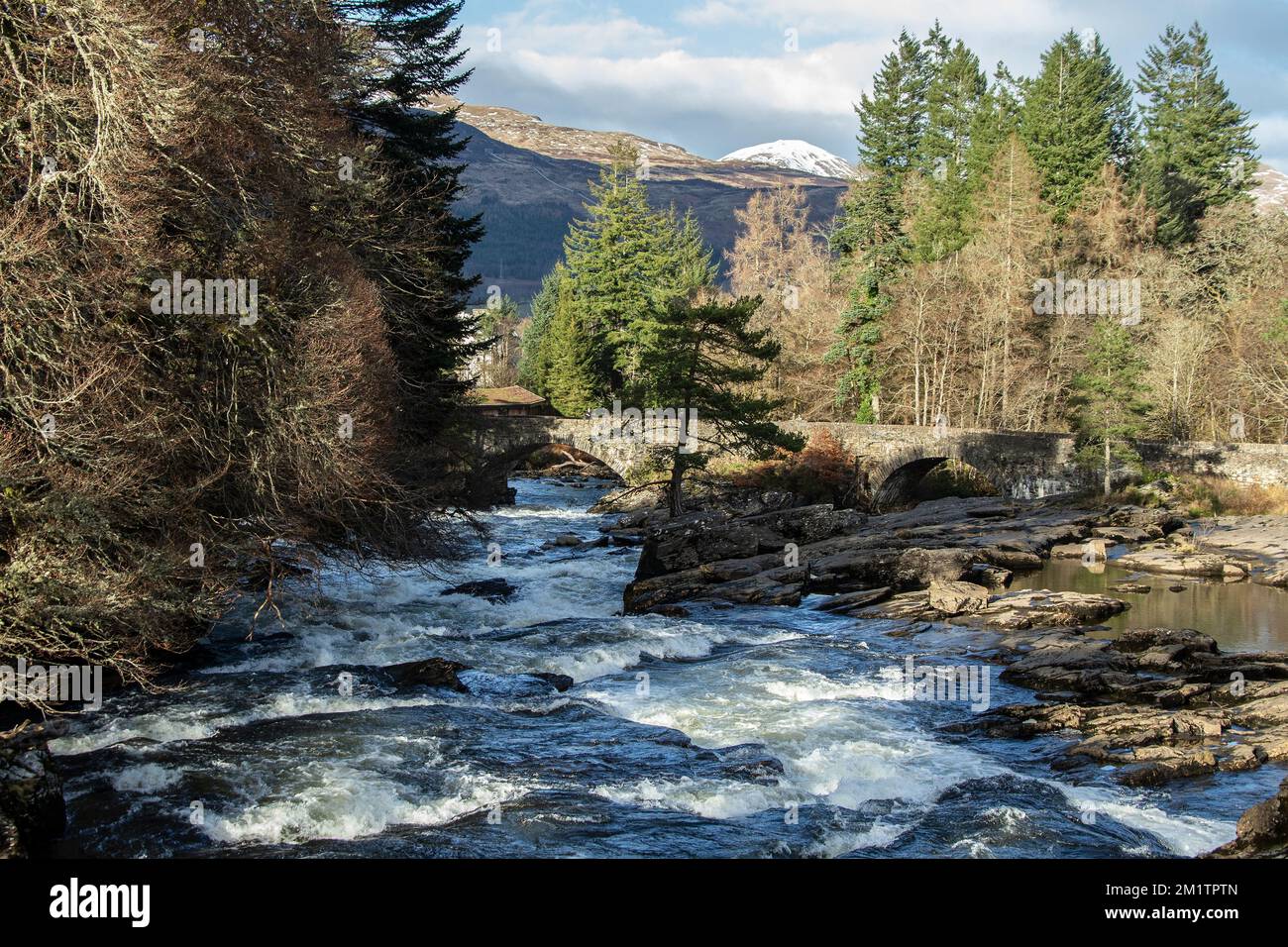 Falls of Dochart looking downstream towards the bridge showing white ...