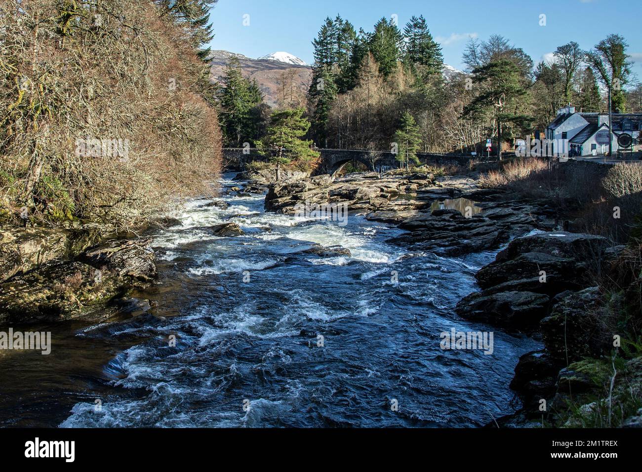 Falls of Dochart looking downstream towards the bridge showing white ...