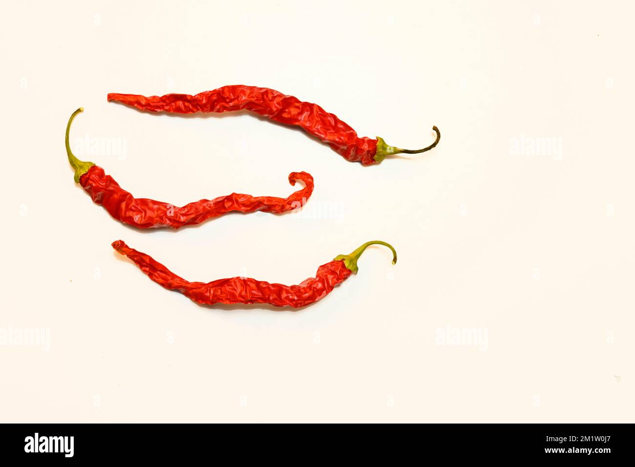 Group of red natural hot peppers. White background Stock Photo - Alamy