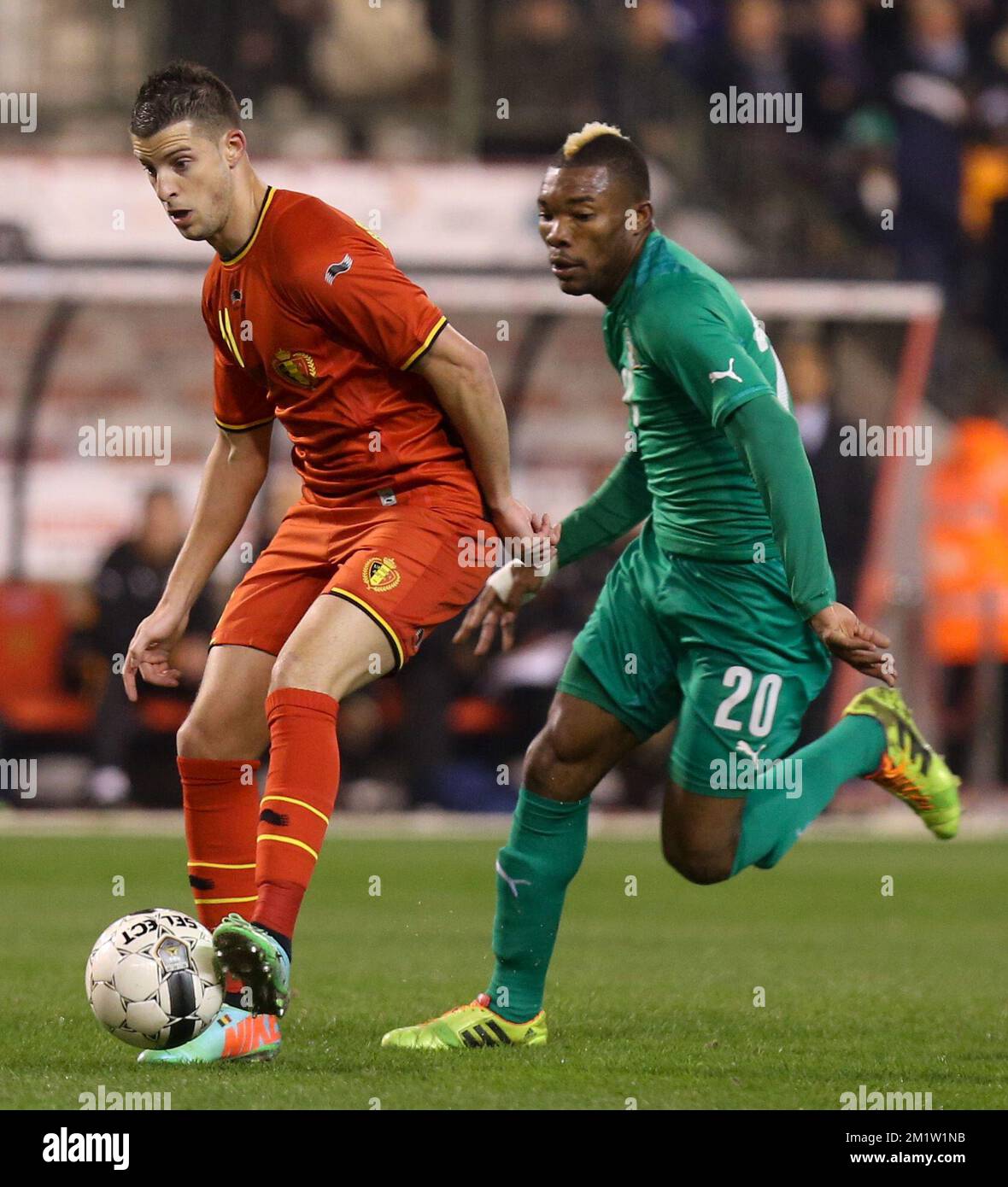 Belgium's Kevin Mirallas and Ivory Coast's Serey Die fight for the ball ...