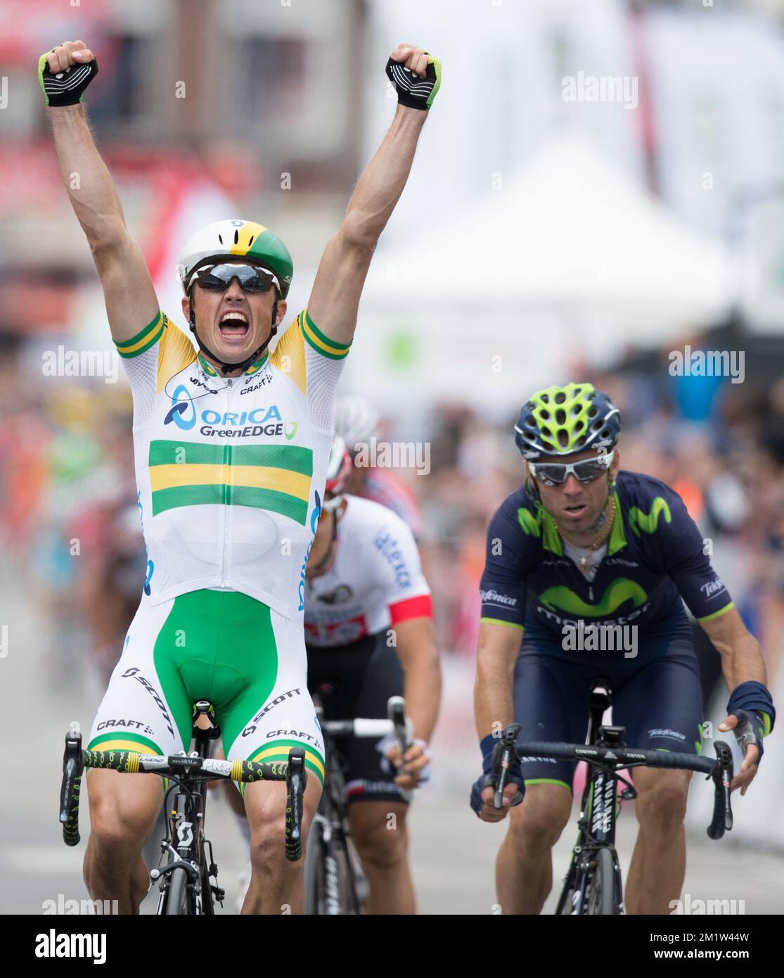 Australian Simon Gerrans of Orica GreenEDGE celebrates with arms up as ...