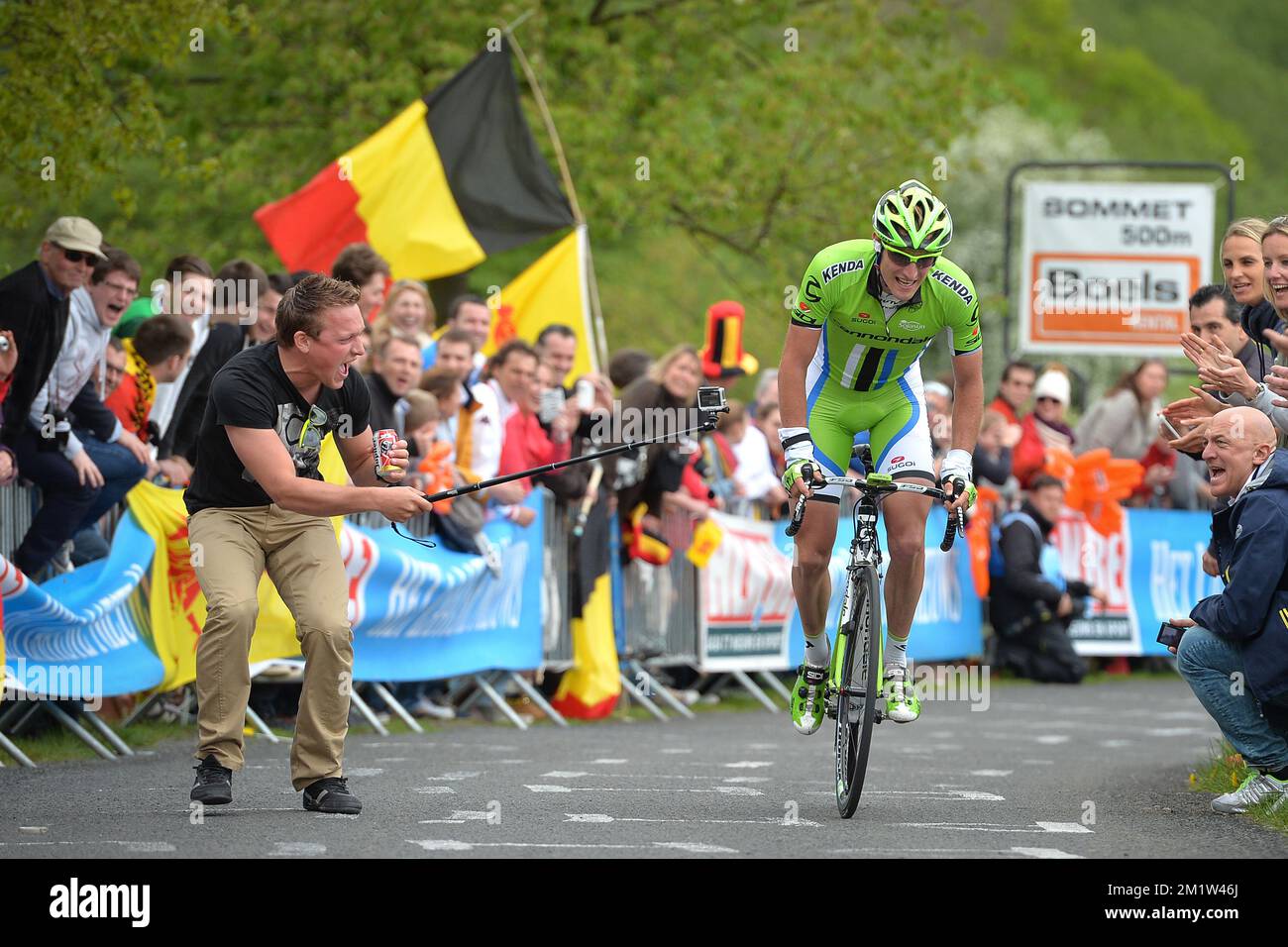 German Michel Koch of Cannondale Pro Cycling in action while a fan is ...
