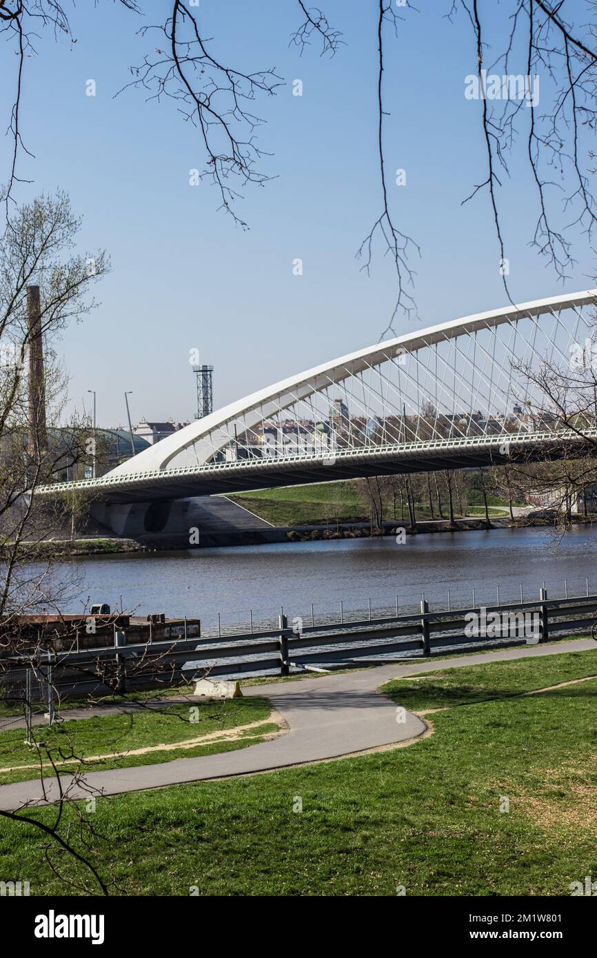 A vertical shot of the Troja bridge against the sunny blue sky in ...
