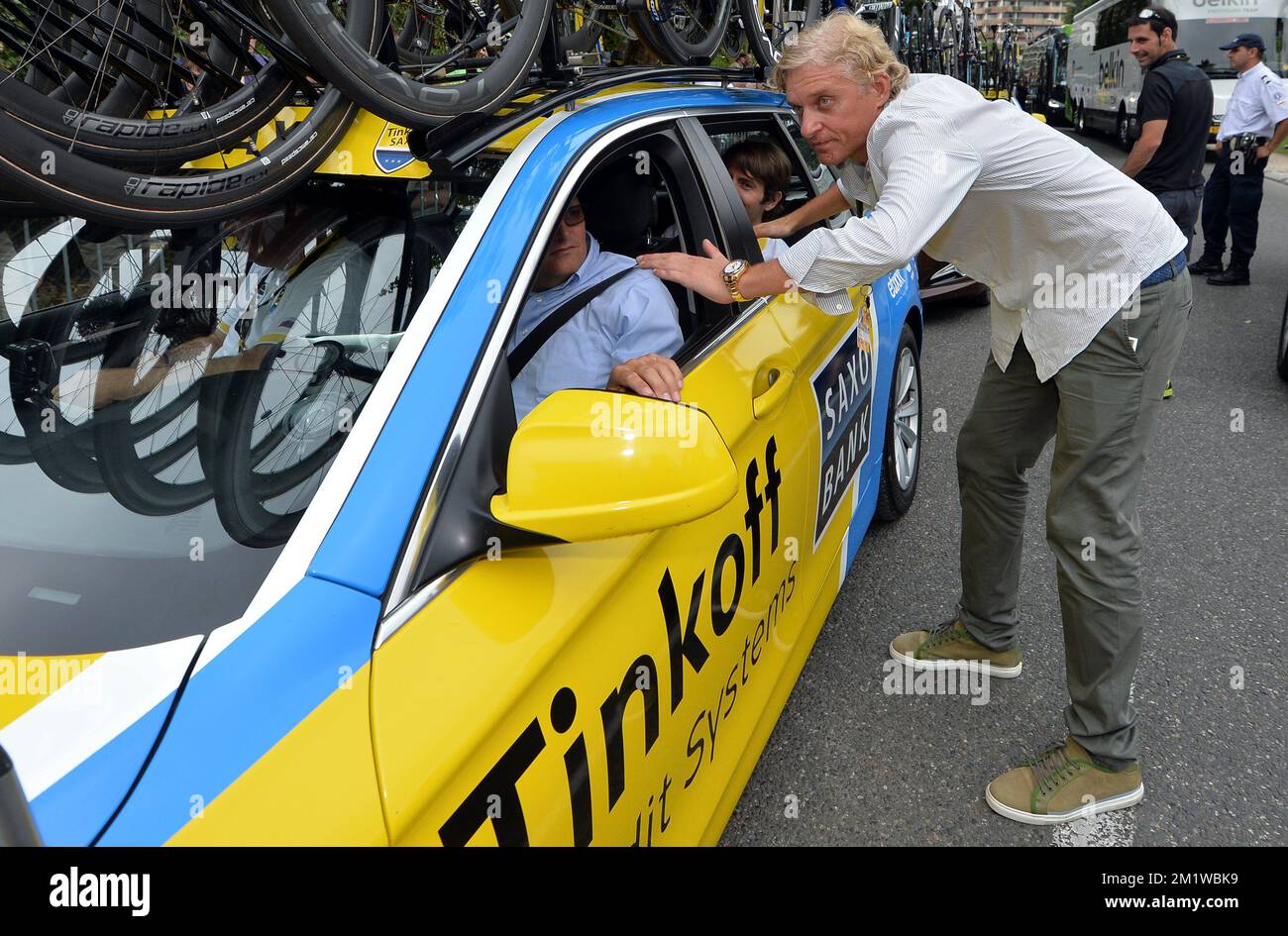 Oleg Tinkoff (R) and Danish Team manager Bjarne Riis of team Saxo ...