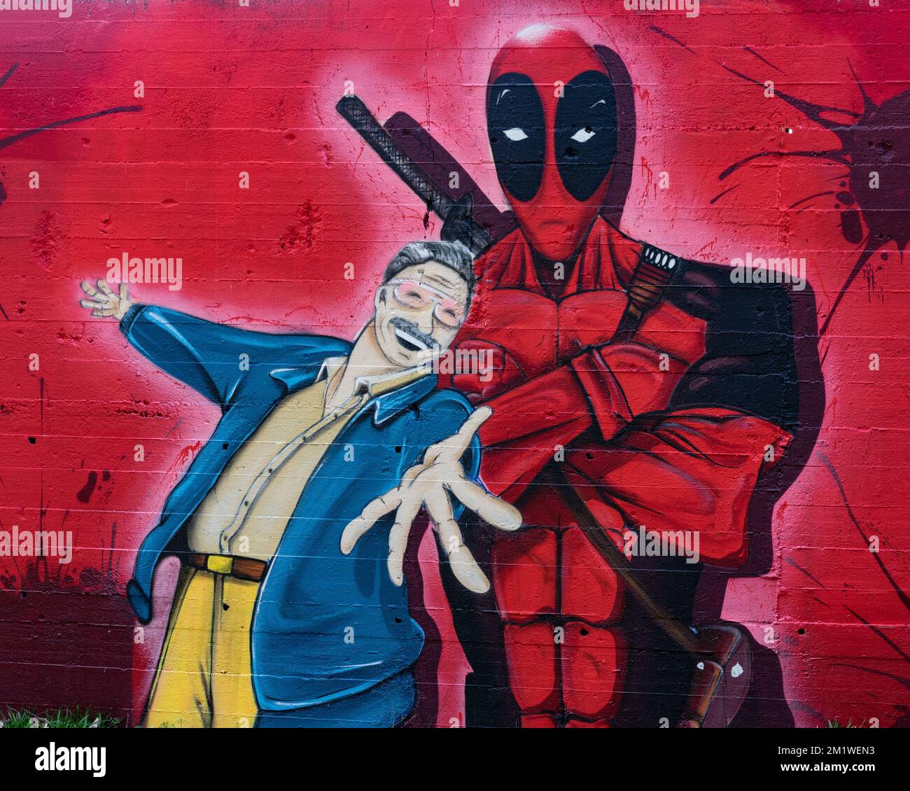 A colorful graffiti with Deadpool character on the wall in Siegen city ...