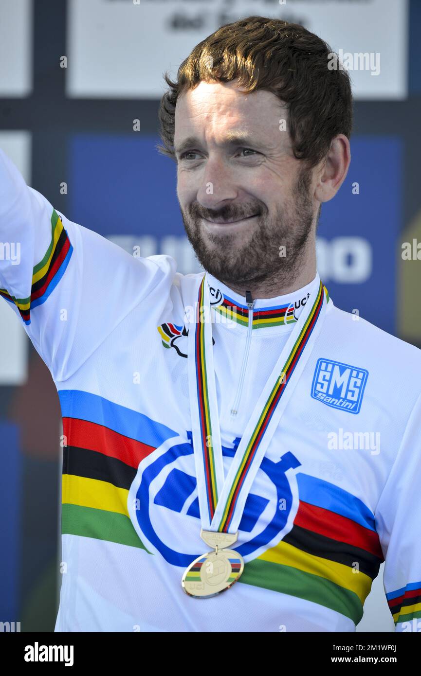 British Bradley Wiggins celebrates on the podium after winning the men ...