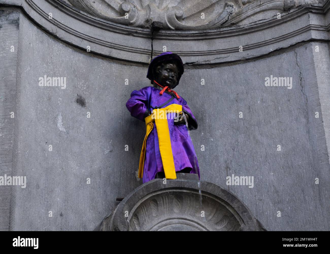 Closed up to famous boy Peeing sculpture knowed as Manneken pis dreesed ...