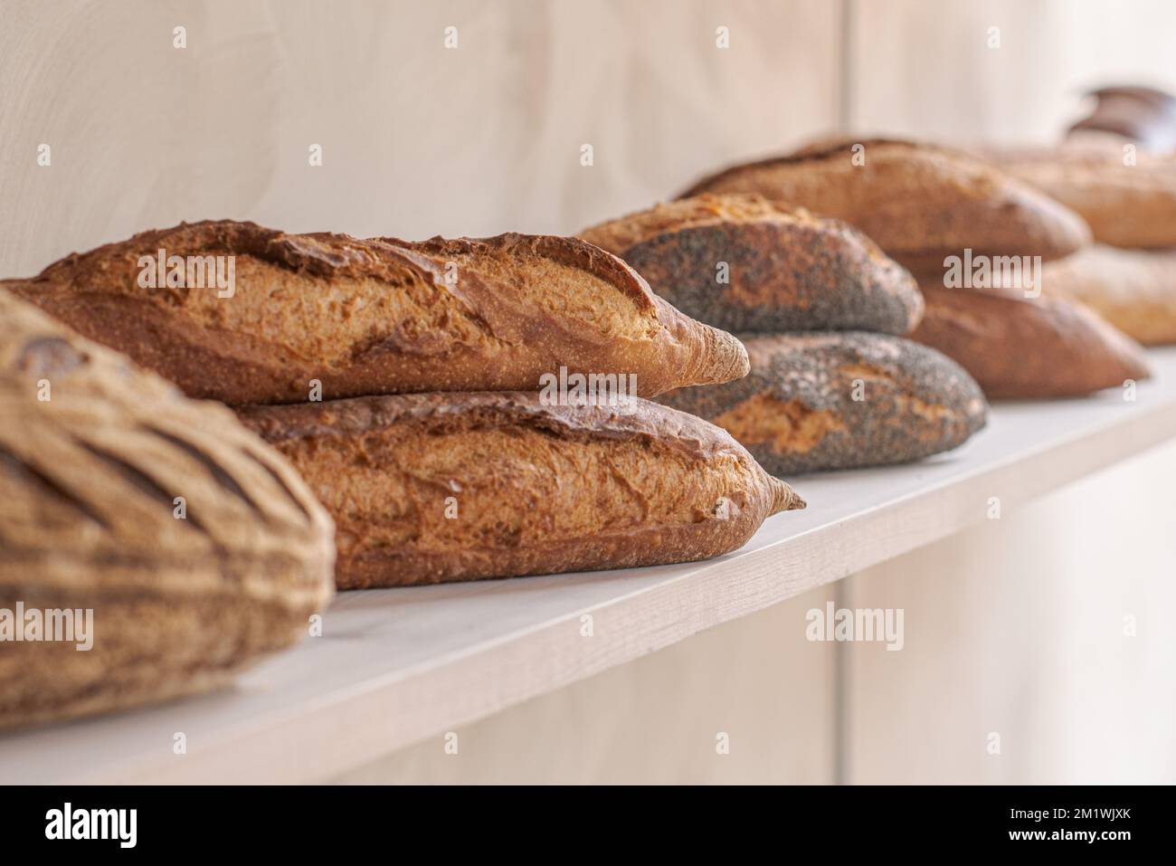 The fresh assortments of bread on the shelf in the bakery Stock Photo ...