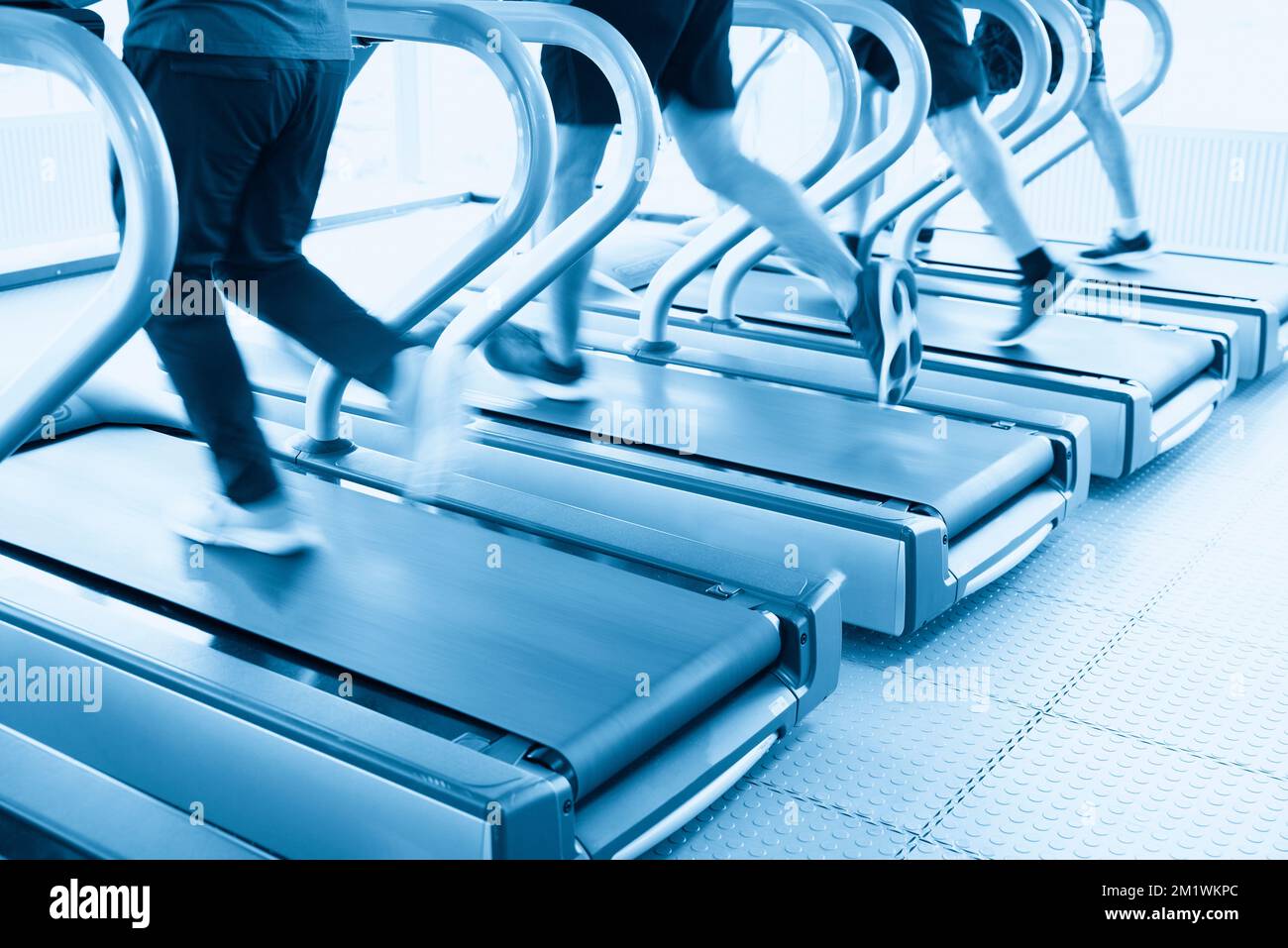 gym shot - people running on machines, treadmill with motion blur Stock ...