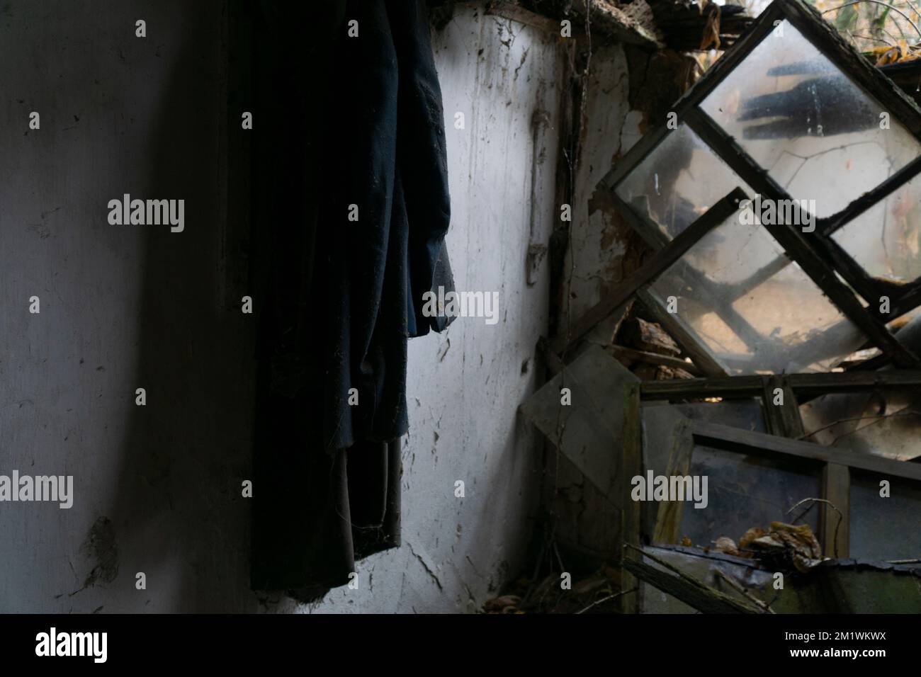 An old clothes and rusty elements inside an abandonated house at ...