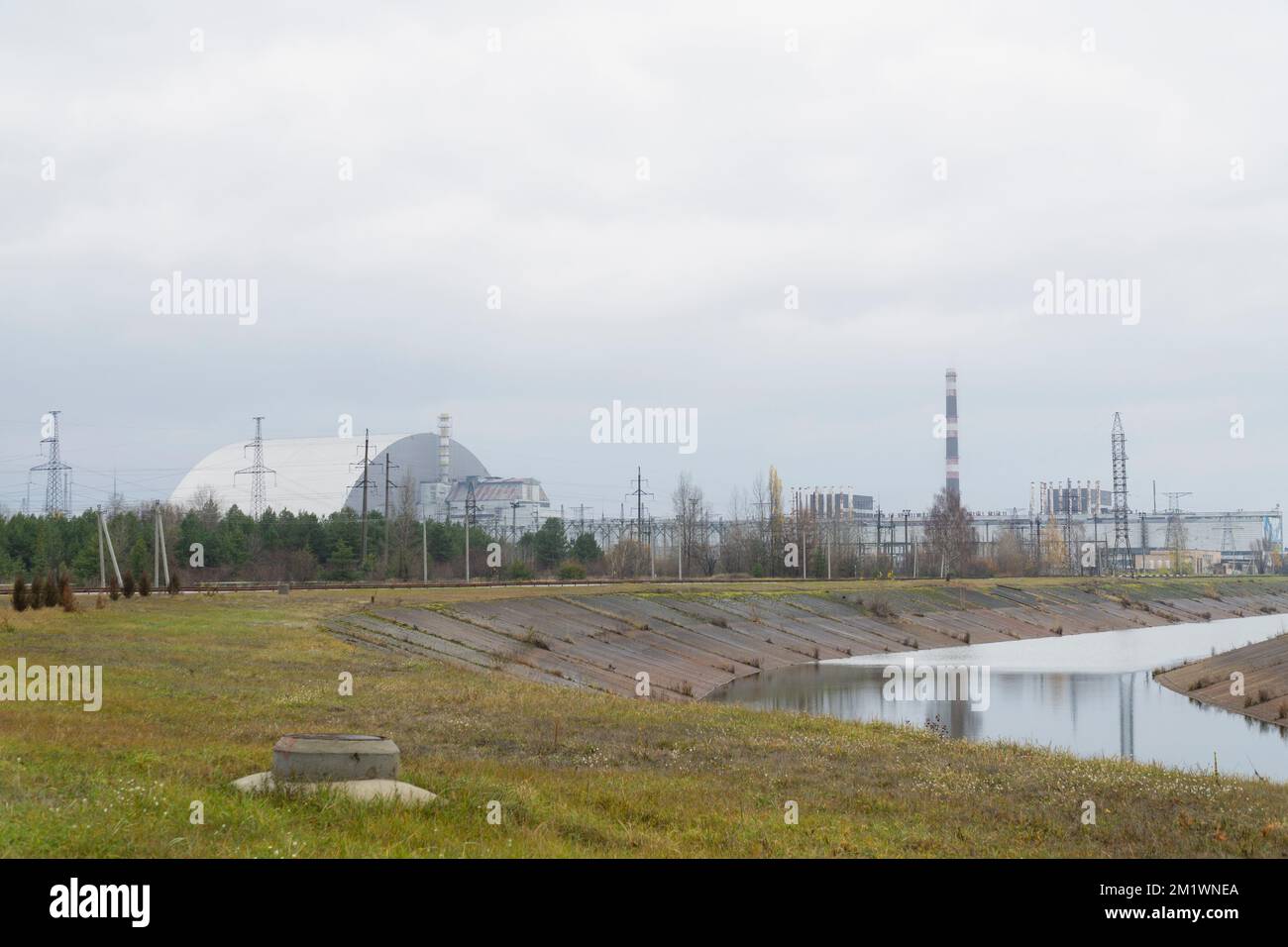 Chernobyl nuclear plant with metal dome over destroyed 4th reactor and ...