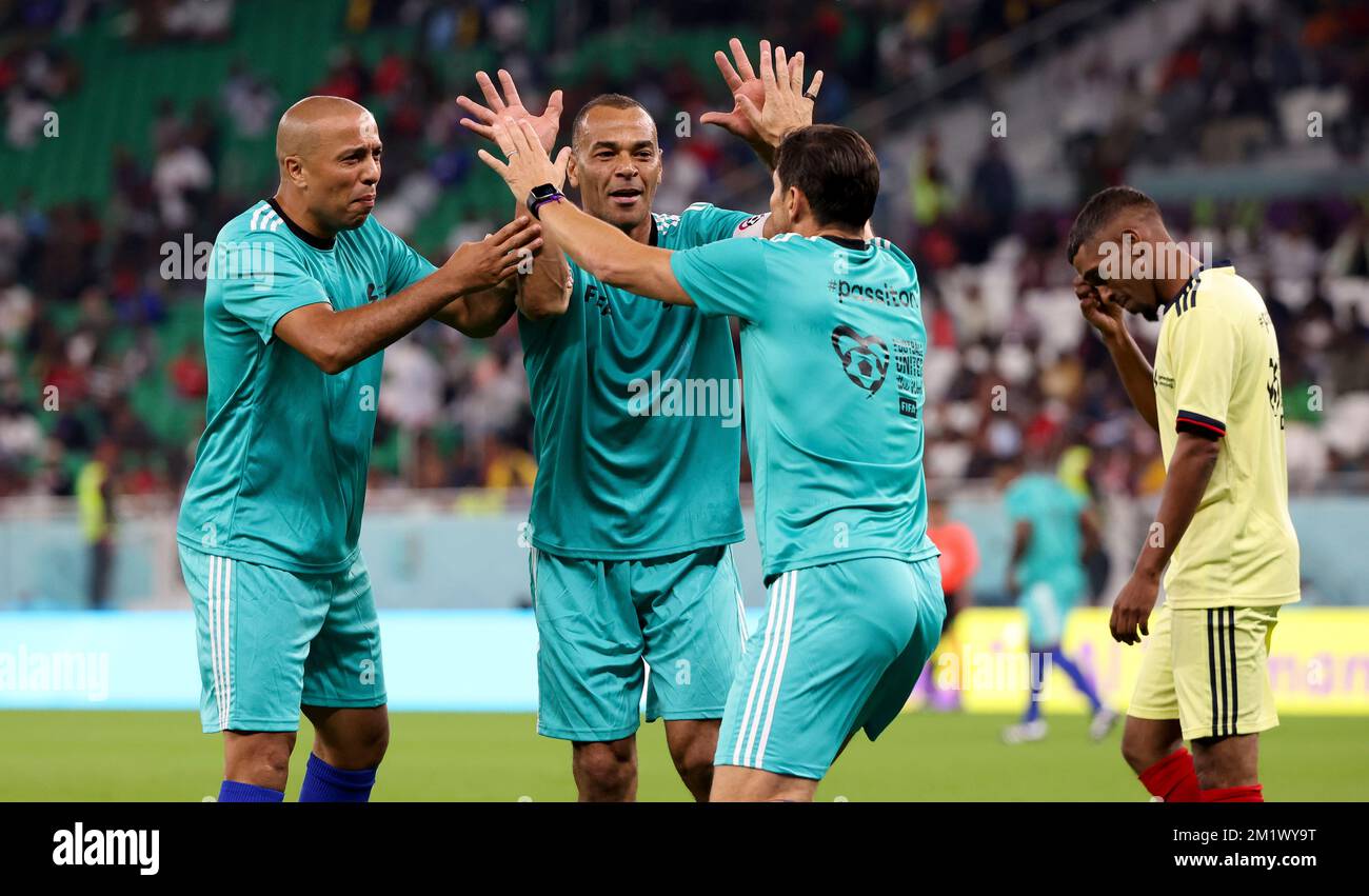 Houssine Kharja of Morocco, Cafu of Brazil celebrate during a football ...